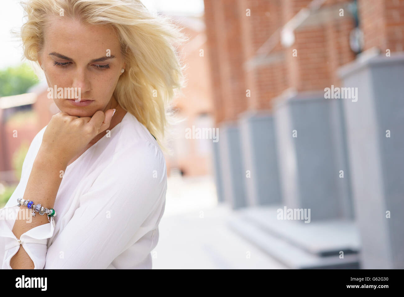 Unhappy worried thinking woman Stock Photo - Alamy