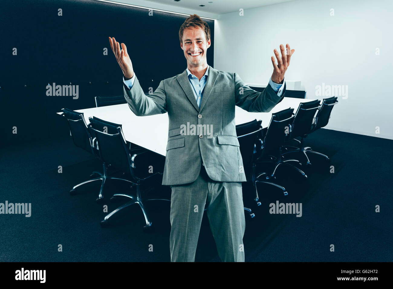 Happy business man in contemporary Conference room Stock Photo - Alamy