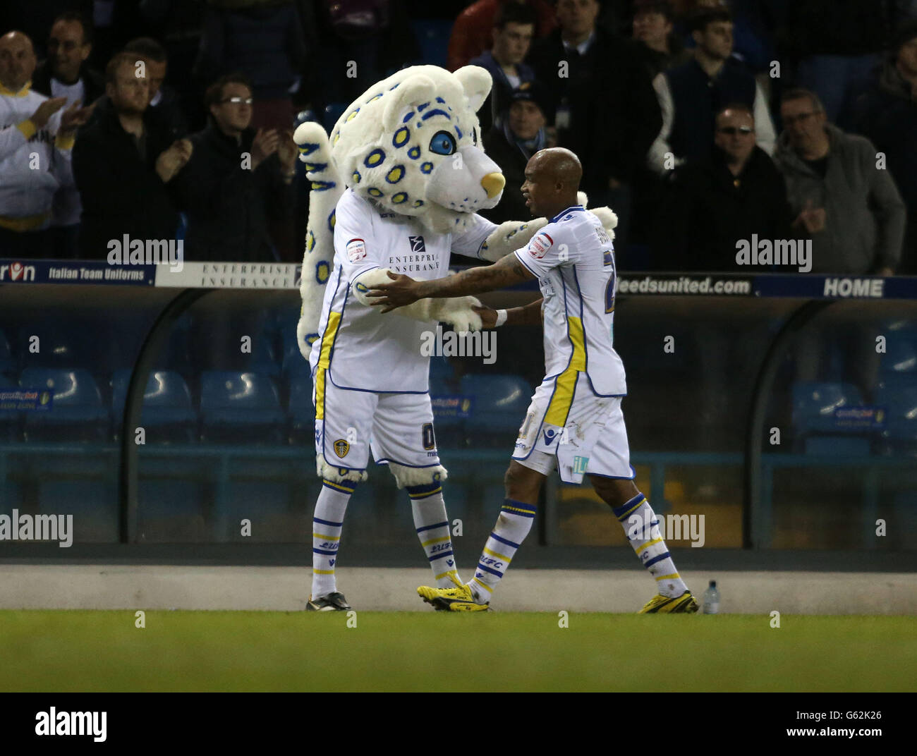 Leeds United's El-Hadji Diouf shakes hands with the mascot after the ...