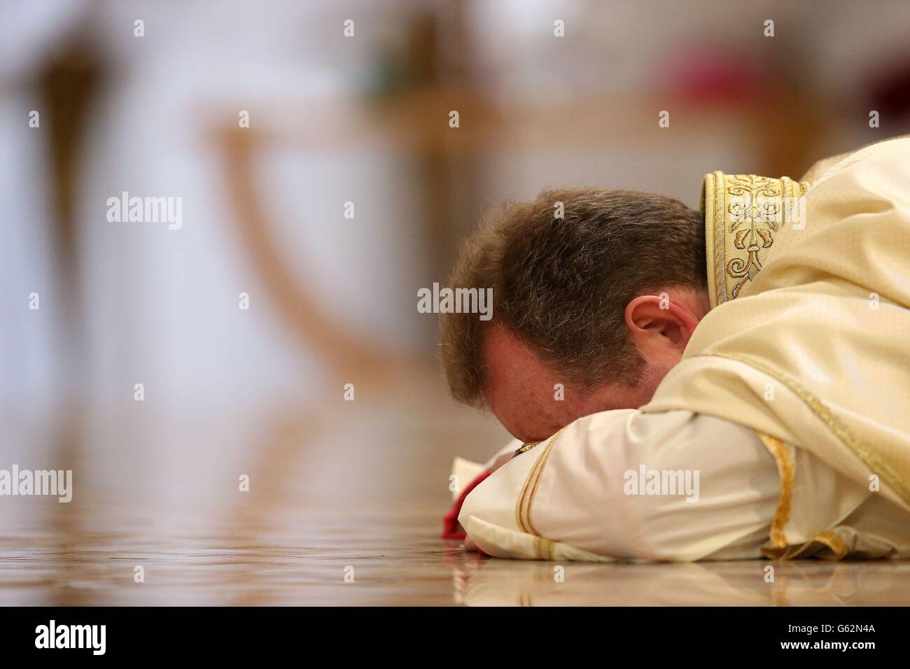 Monsignor Eamon Martin lies on the floor during The Litany of the ...