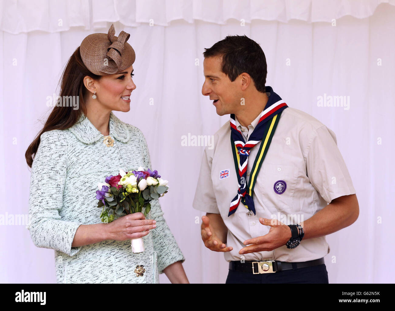 The Duchess of Cambridge with Chief Scout Bear Grylls (right) as she ...