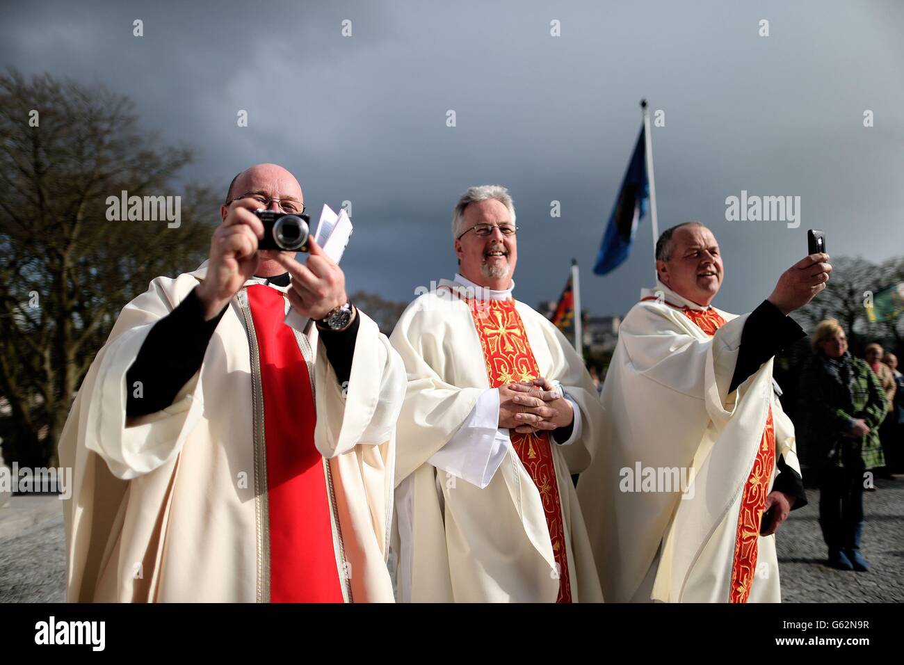 Priests take pictures after the Episcopal Ordination of Monsignor Eamon ...