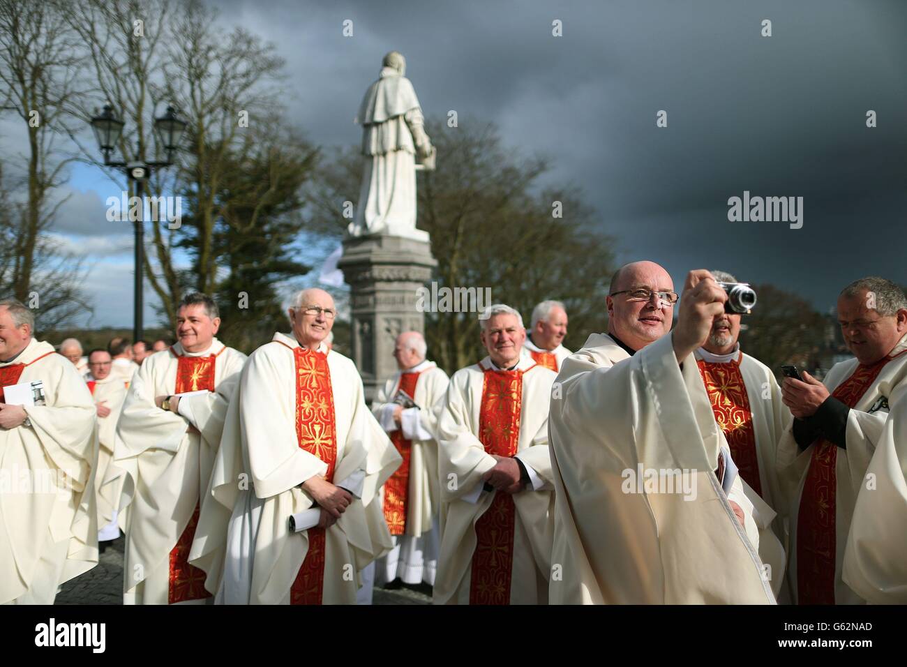 Priests take pictures after the Episcopal Ordination of Monsignor Eamon ...