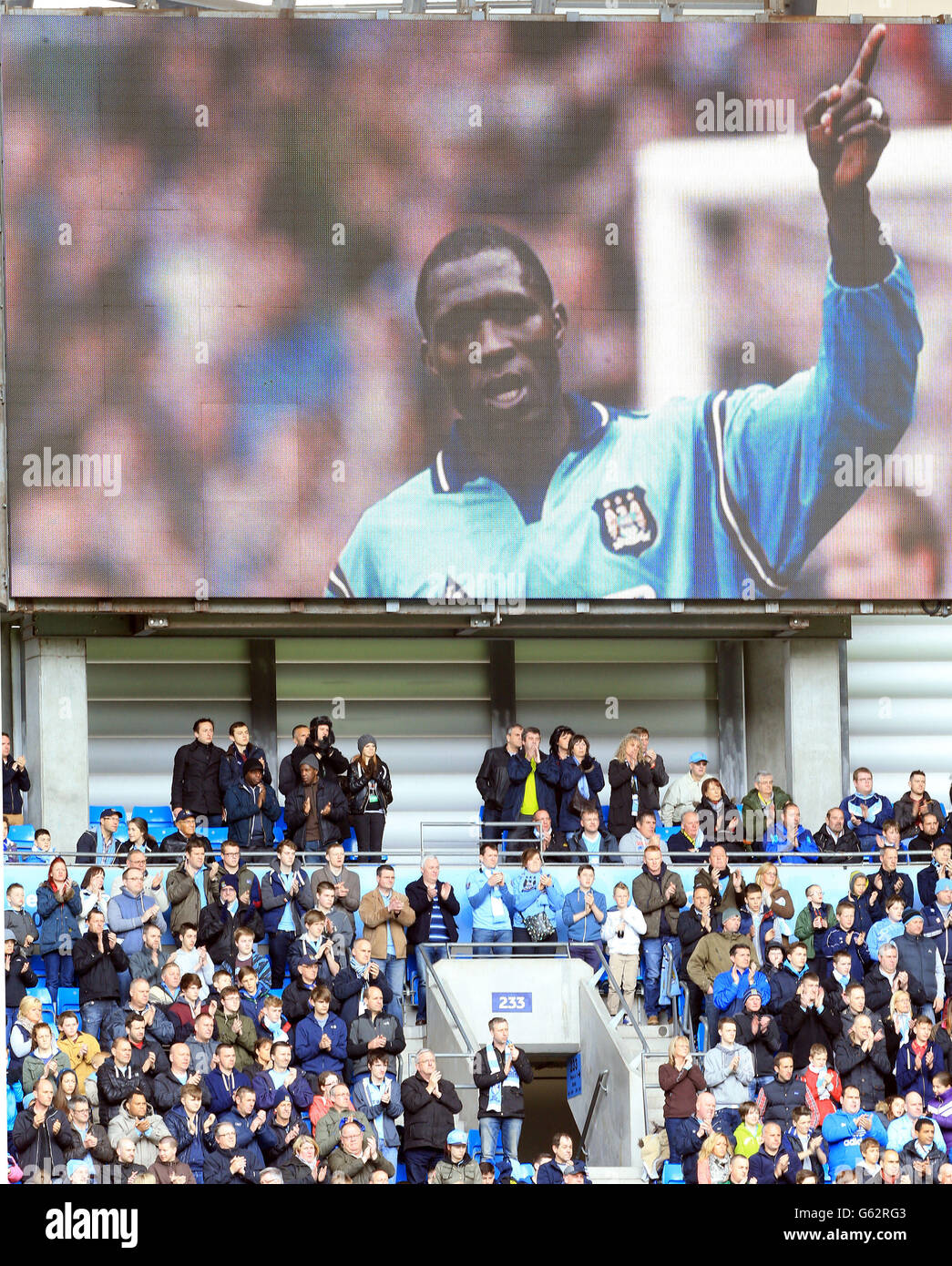 A tribute to former footballer Marc Vivien-Foe is shown on the big ...