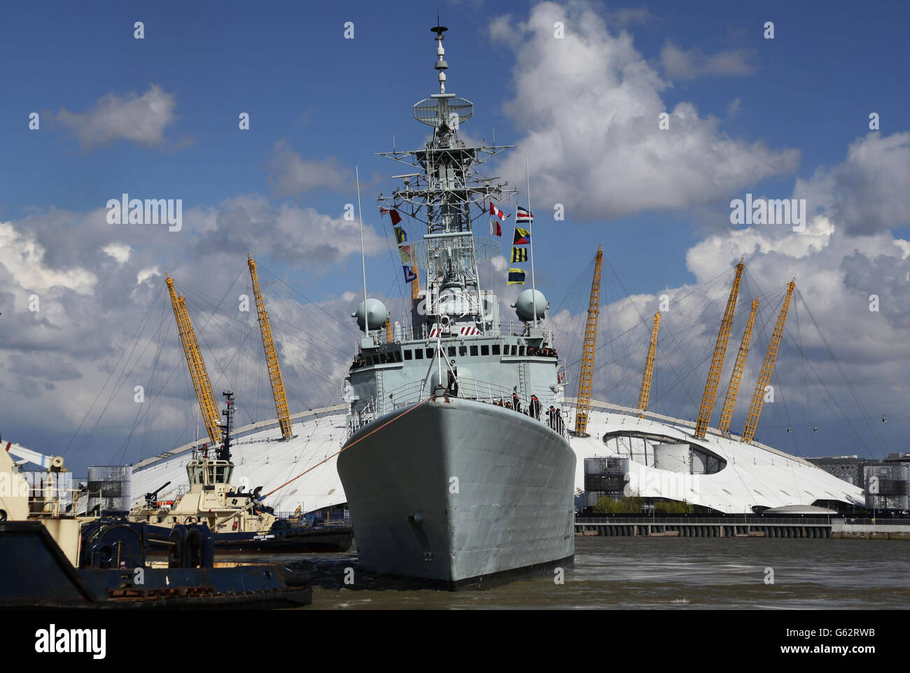 Canadian naval frigate HMCS Iroquois is towed along the Thames pass the ...