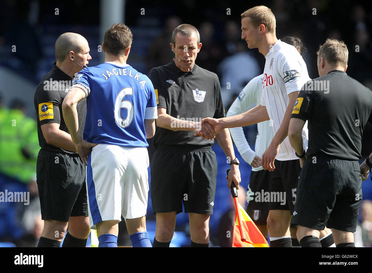 Everton captain Phil Jagielka (left) and Fulham captain Brede Hangeland ...