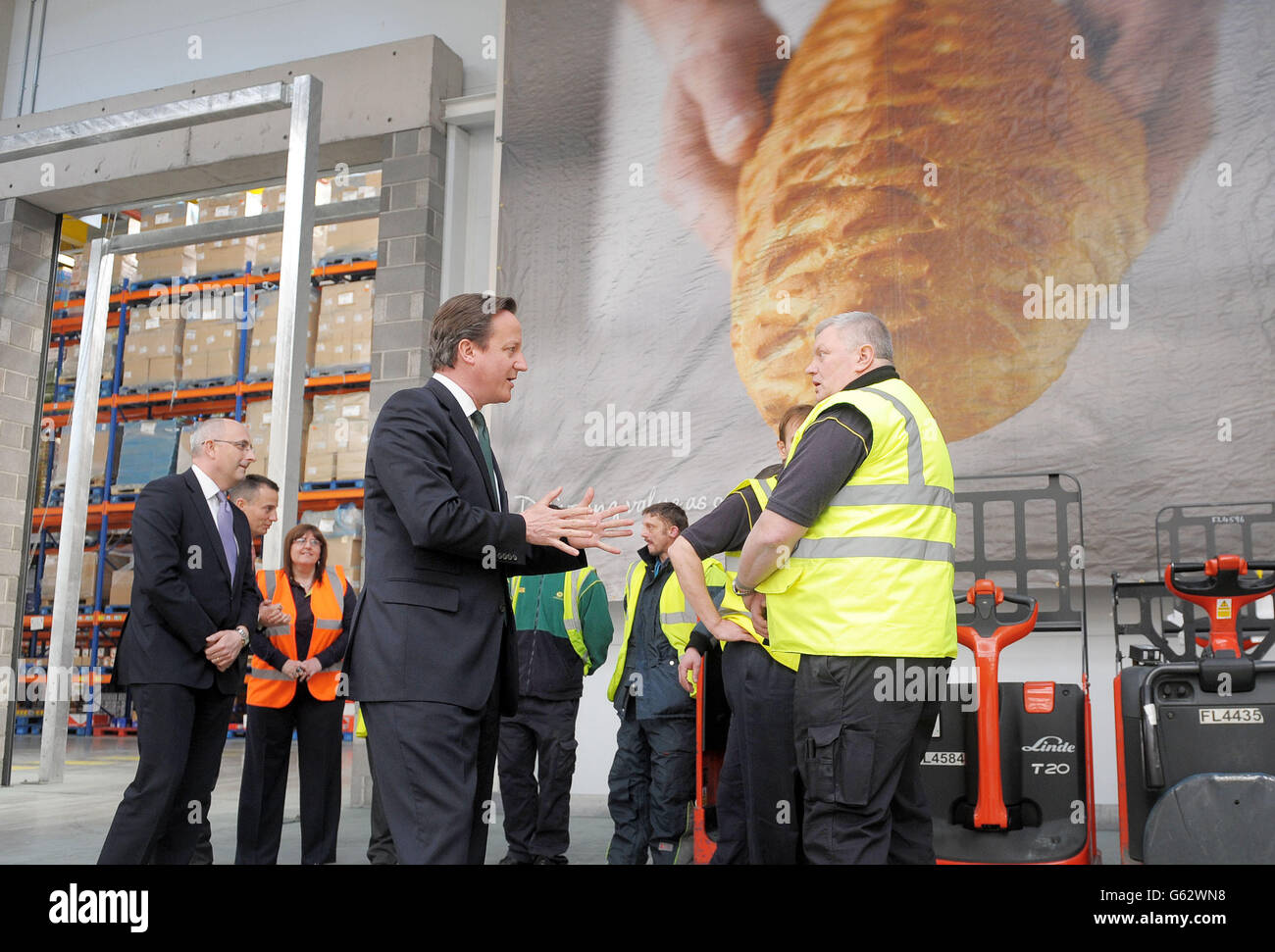 Prime Minister David Cameron speaks to workers at the Morrisons ...