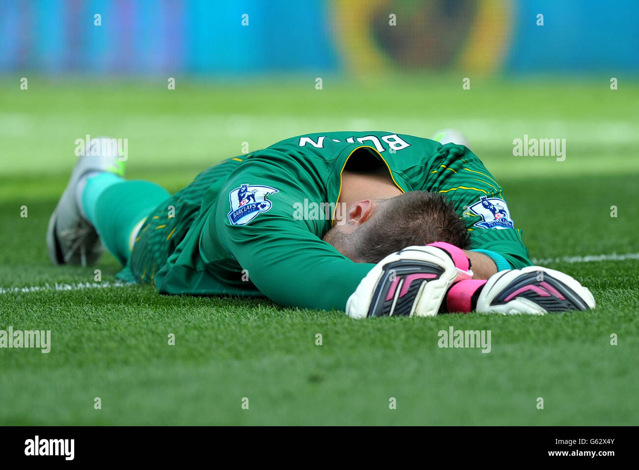 Norwich city goalkeeper mark bunn lies injured on the grass hi-res ...