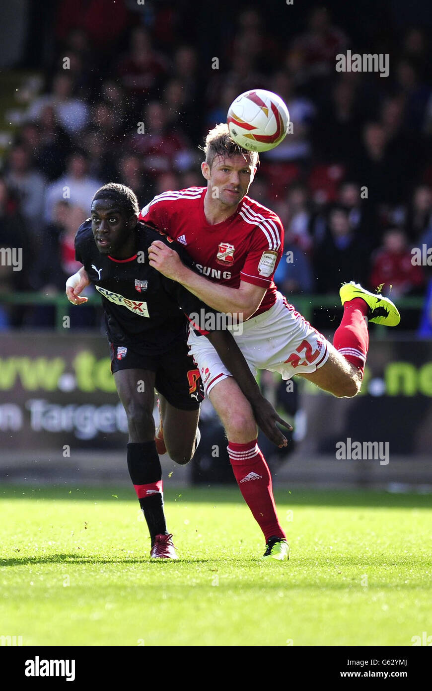Brentfords clyaton donaldson left and swindon towns darren ward hi-res ...