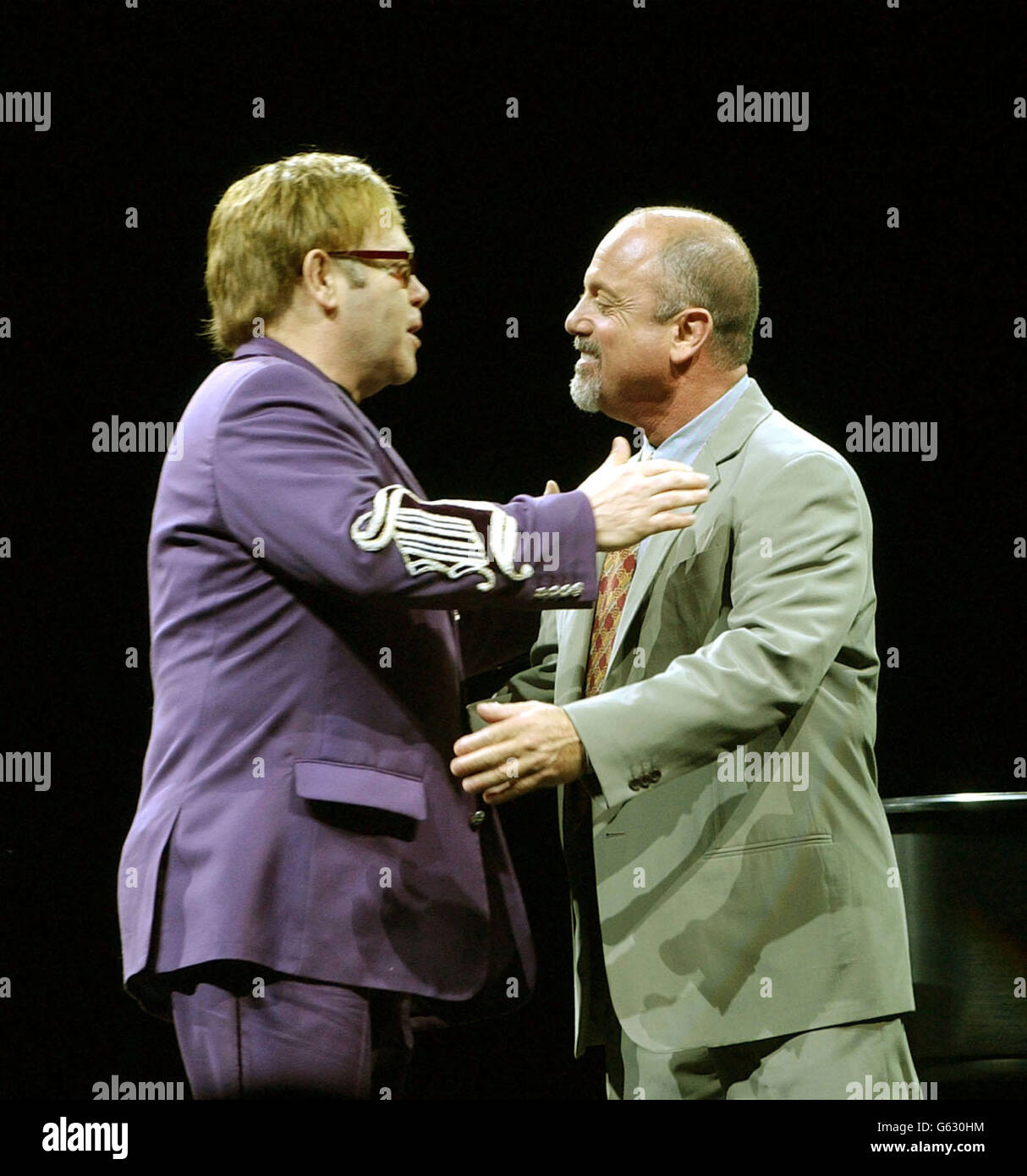 Celebrity music pianist purple suit khaki suit on stage hi-res stock ...