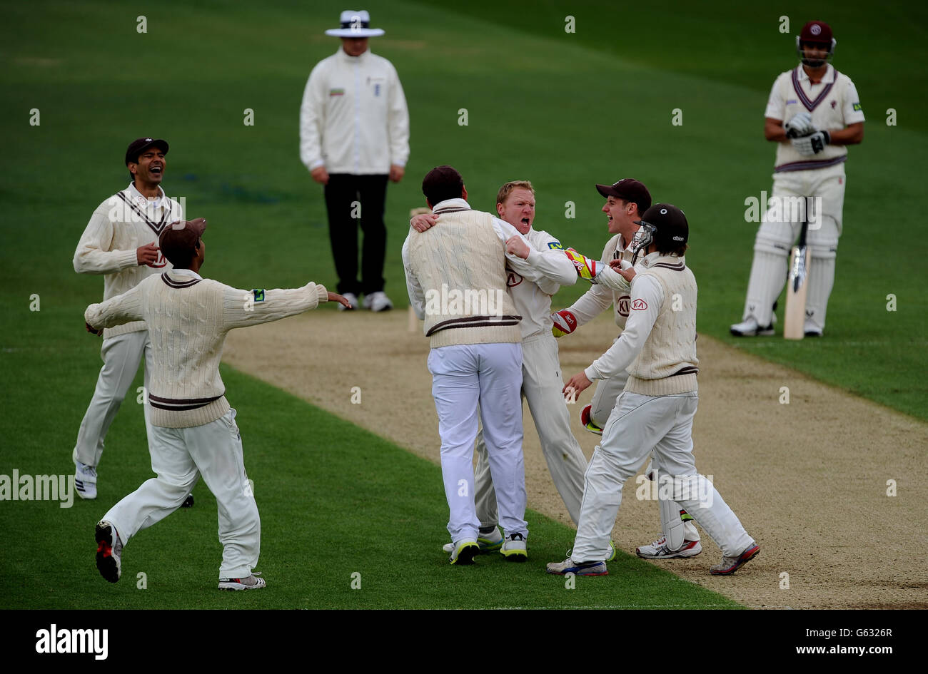 Surrey's Gareth Batty (centre facing) celebrates with team mates after ...