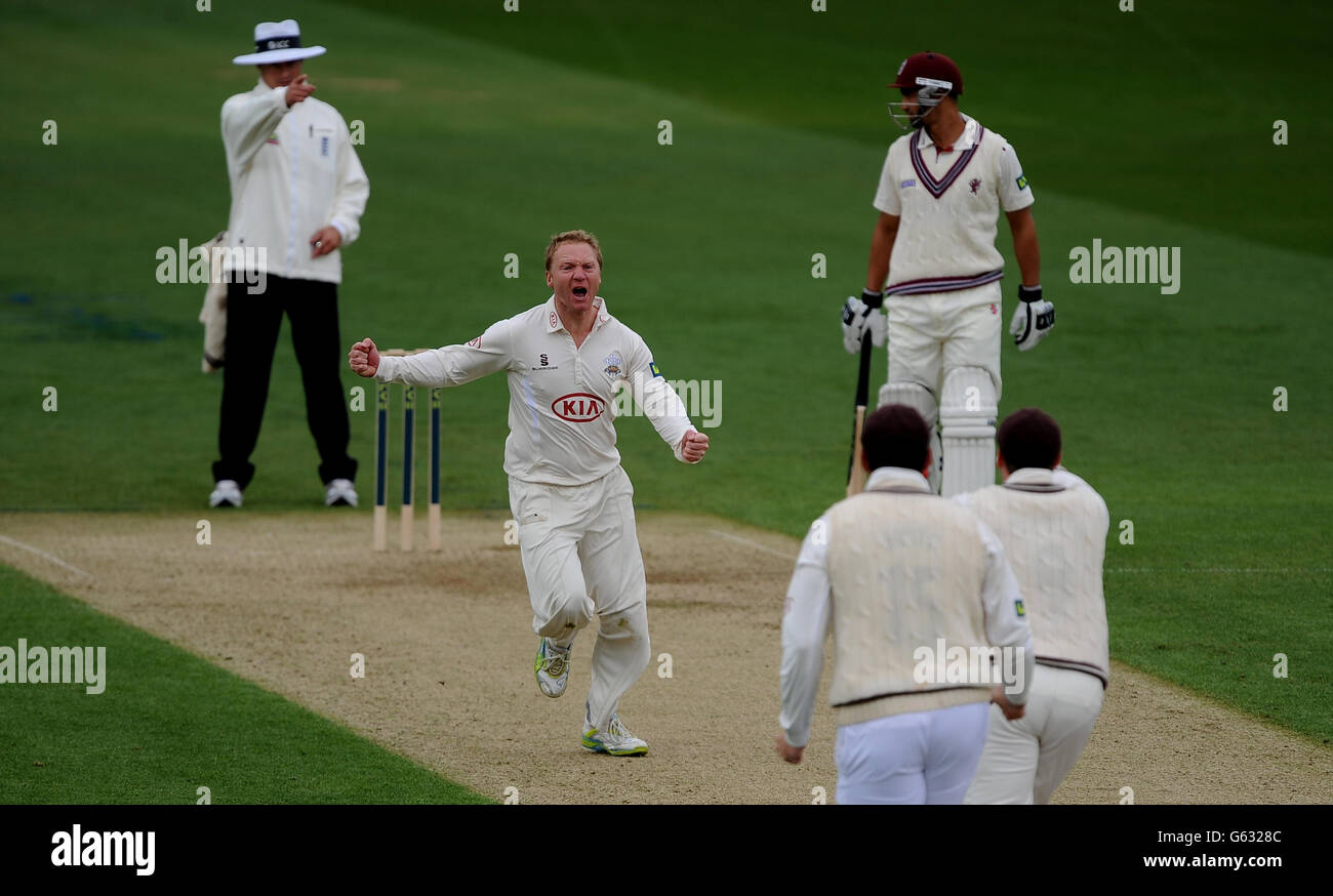 Surrey's Gareth Batty (left facing) celebrates with Graeme Smith ...