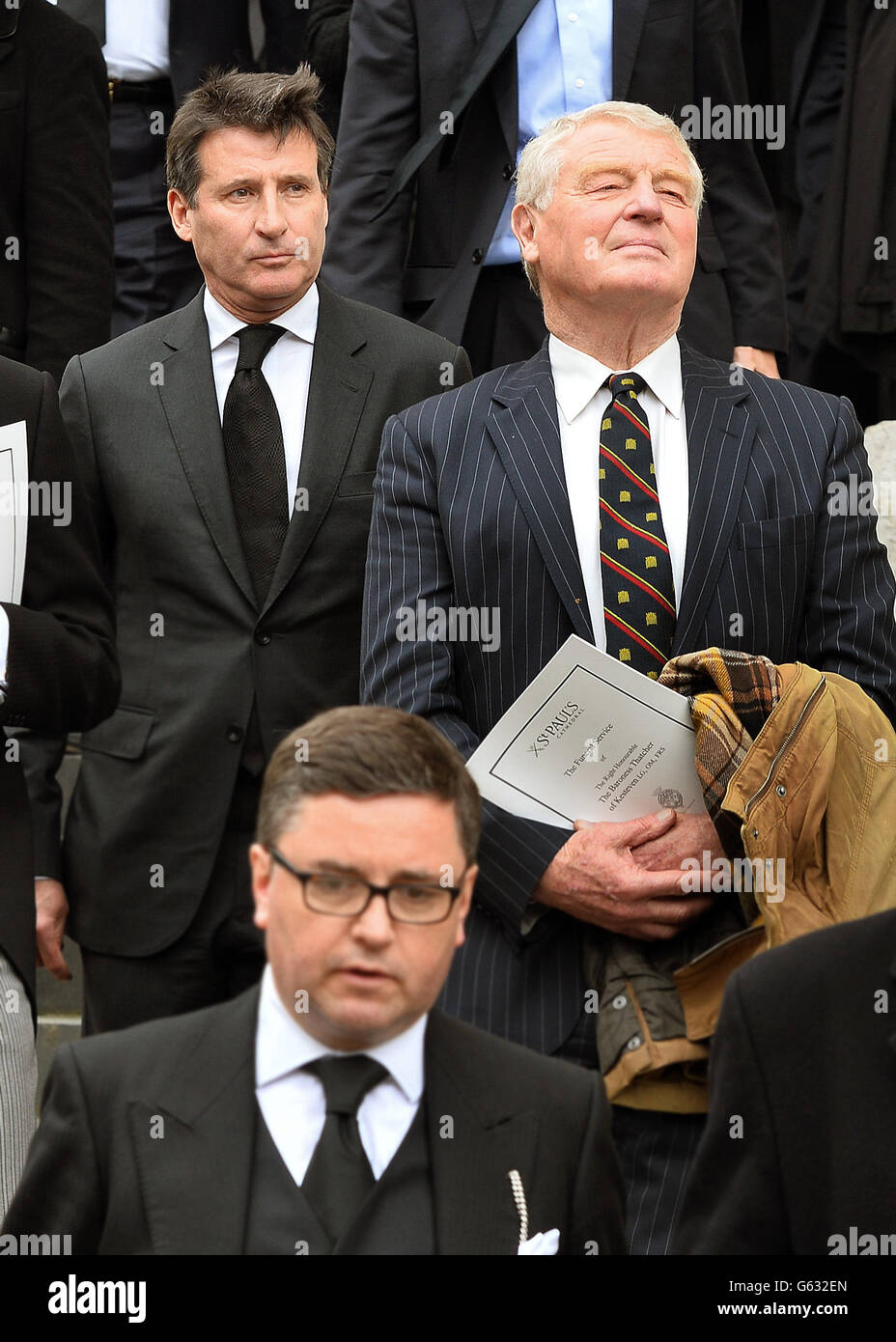 Lord Seb Coe and Paddy Ashdown (right) leave after the funeral service ...