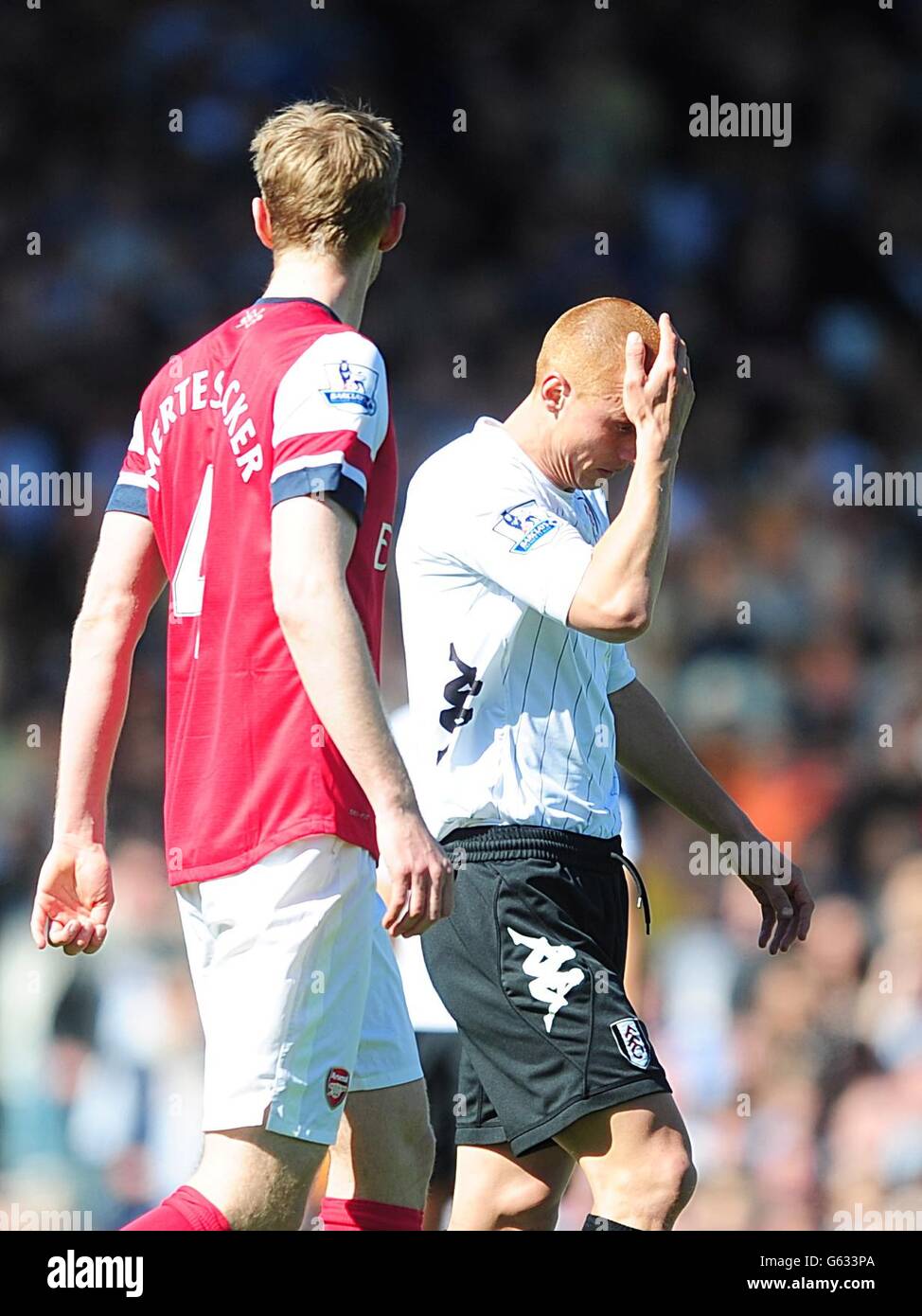 Fulham's Steve Sidwell (right) shows his dejection after being shown a ...