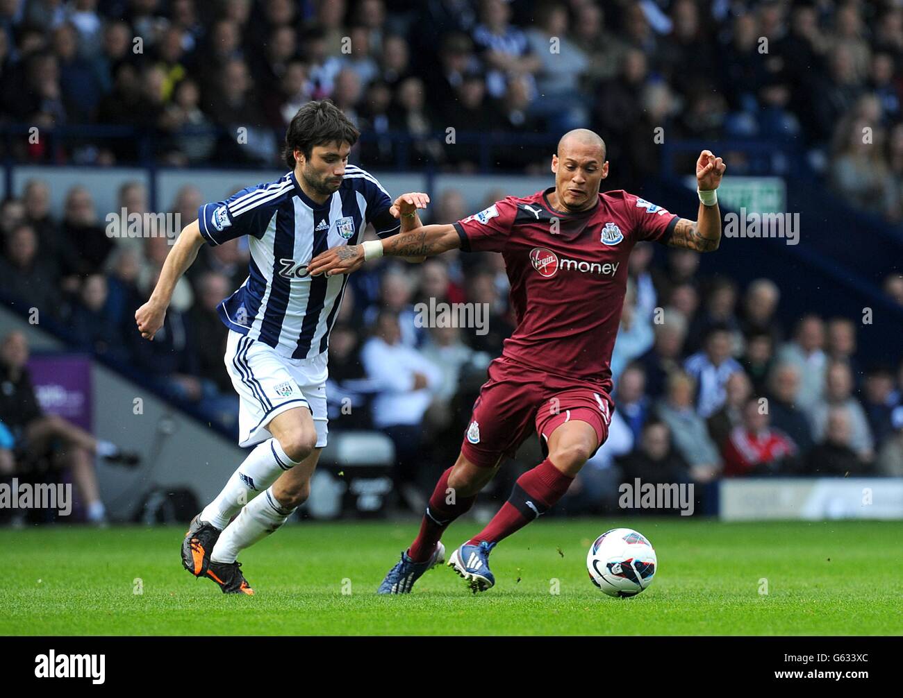 West Bromwich Albion's Goran Popov (left) and Newcastle United's Yoan ...