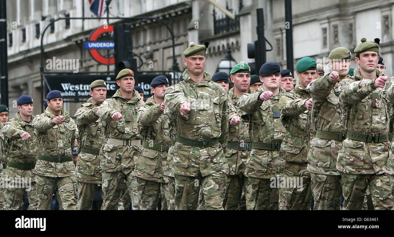 Soldiers from The 4th Mechanised Brigade parade past the Houses of ...