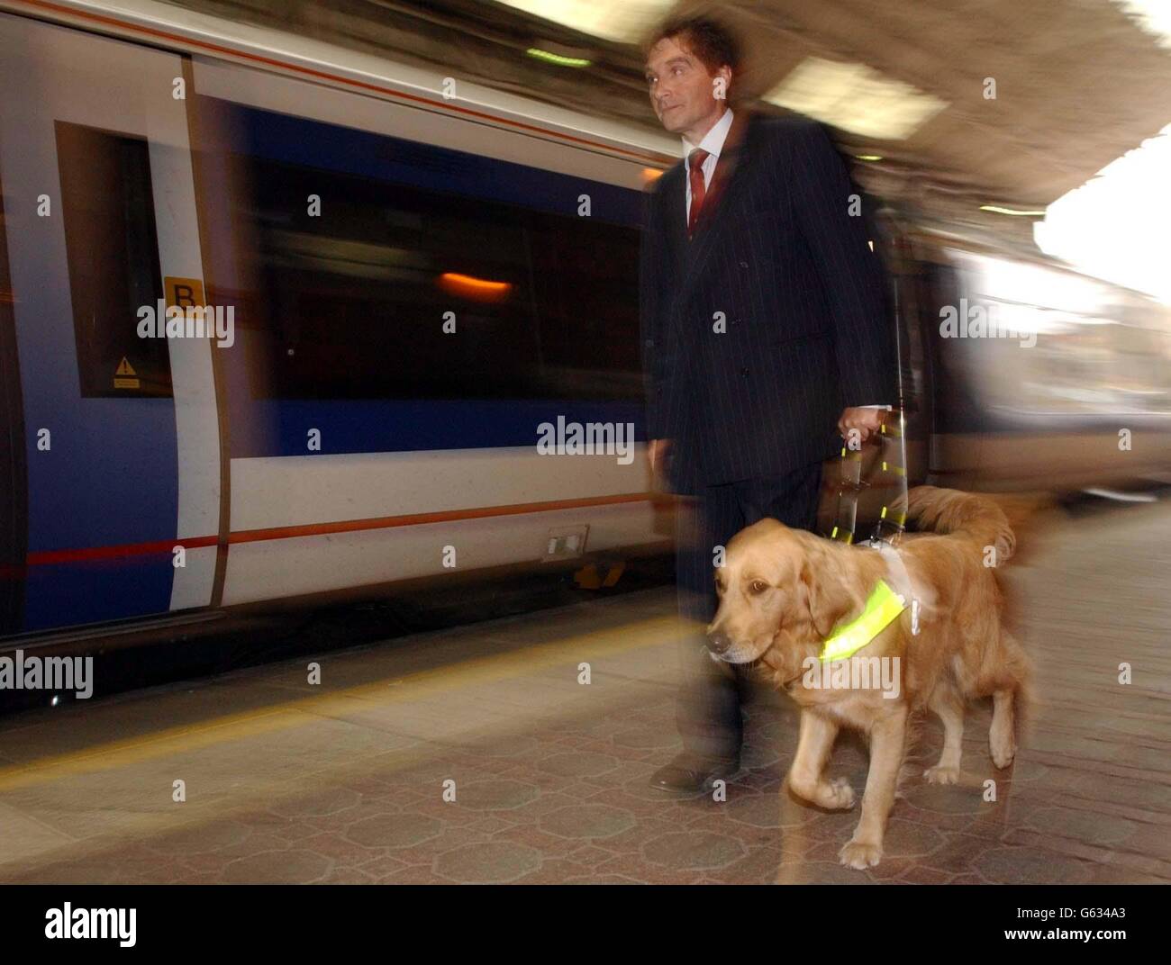 Tom Pey and his guide dog Rupert at London's Marylebone Station, during ...