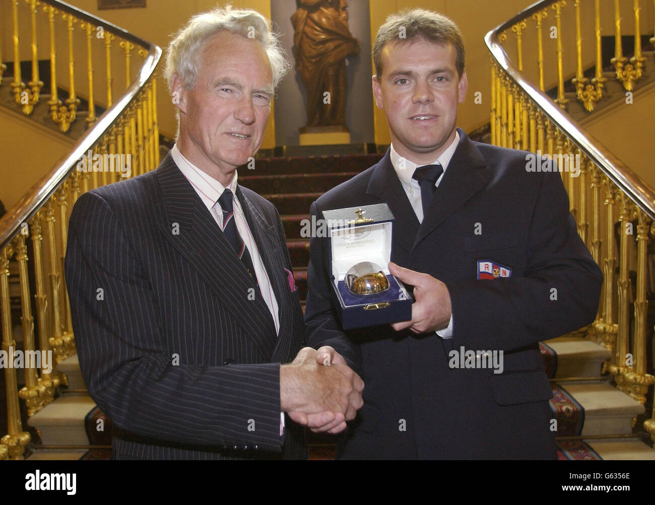 Admiral of the Fleet, Sir Julian Oswald, left, hands over the Lady ...