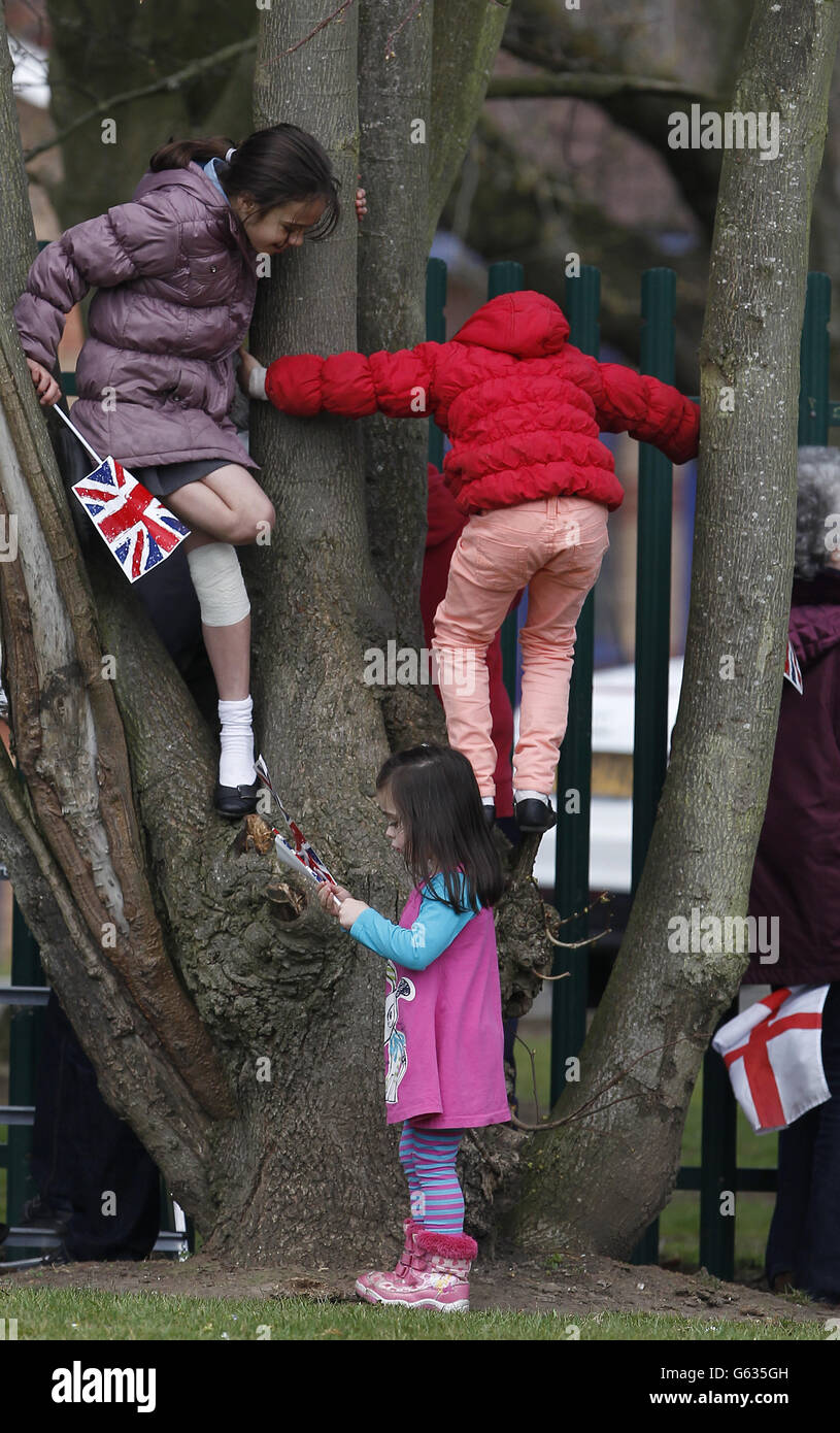 Bethany Regan (left) climbs a tree with her sisters to try and get a ...