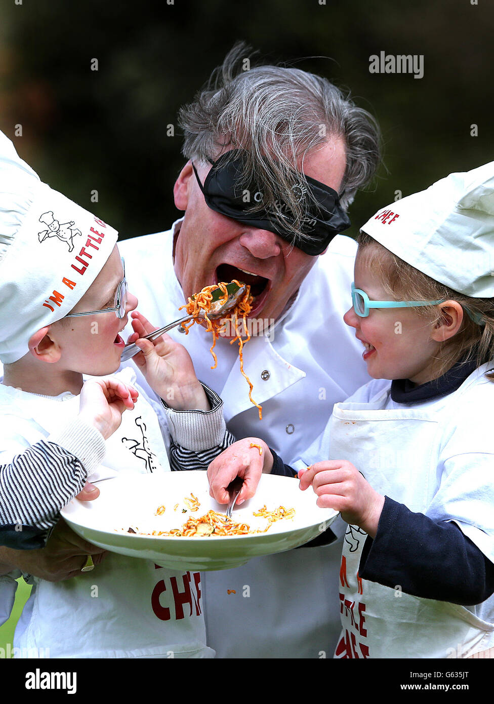 Michelin Star chef Derry Clarke gets a spoonful of pasta from little ...