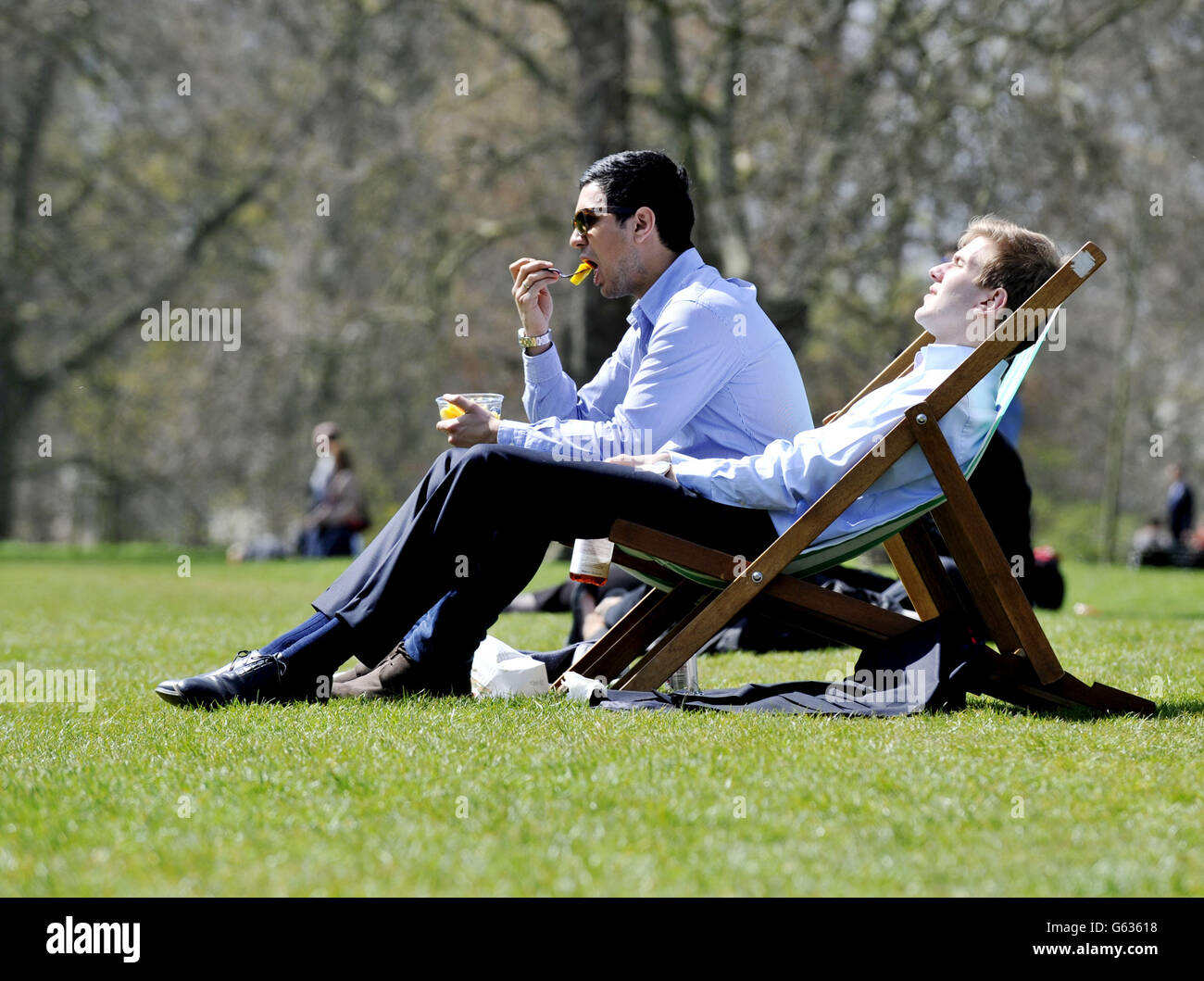 Office workers enjoy the spring weather in Green Park, central London ...
