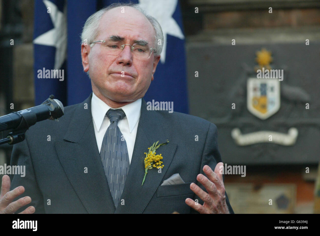 Two Royal Australian Air Force chaplains listen as the Australian Prime ...