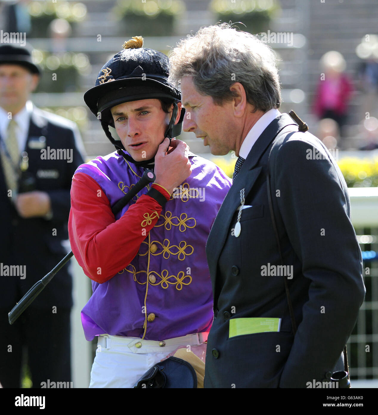 Jockey Ryan Moore chats with the Queens racing manager John Warren ...