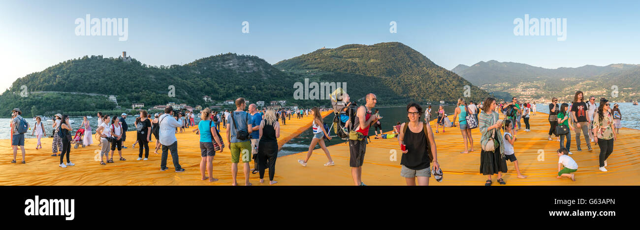 The Floating Piers Christo project. Visitors walking from Sulzano to ...