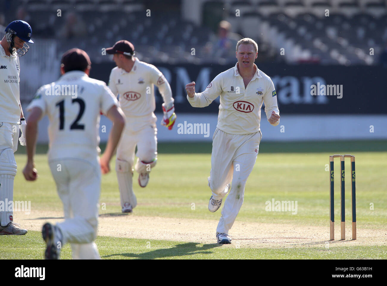 Surrey's Gareth Batty (right) celebrates the wicket of John Simpson ...