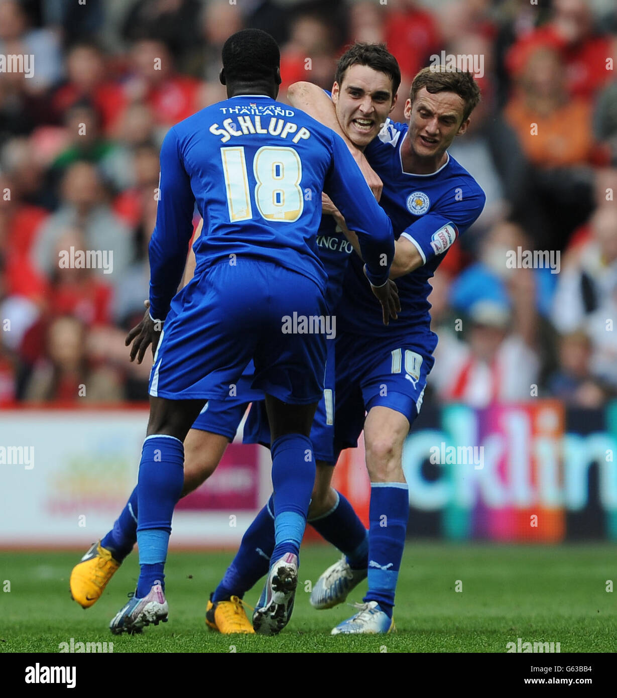 Leicester City's Matty James (centre) celebrates with Jeff Schlupp ...