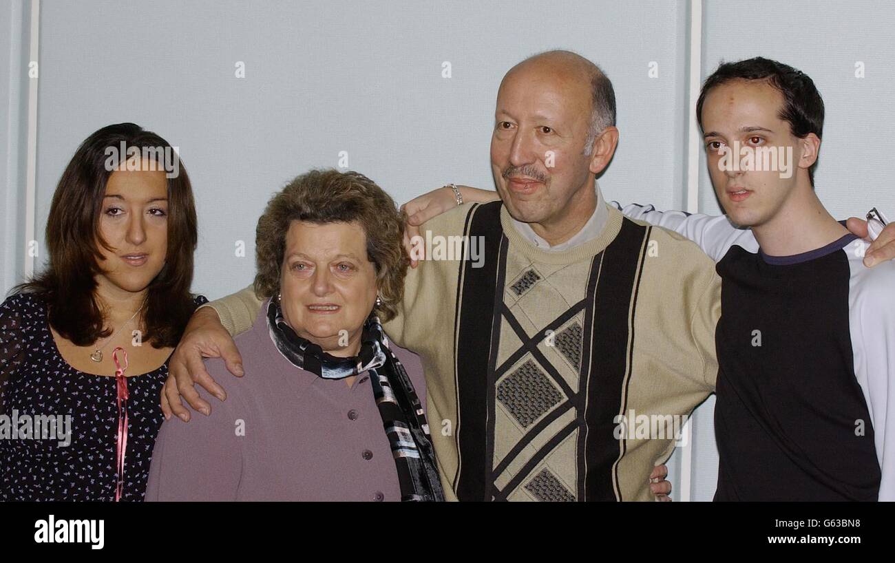 Peter Low (middle) arrives at Heathrow, from Moscow. Mr Low, his wife ...