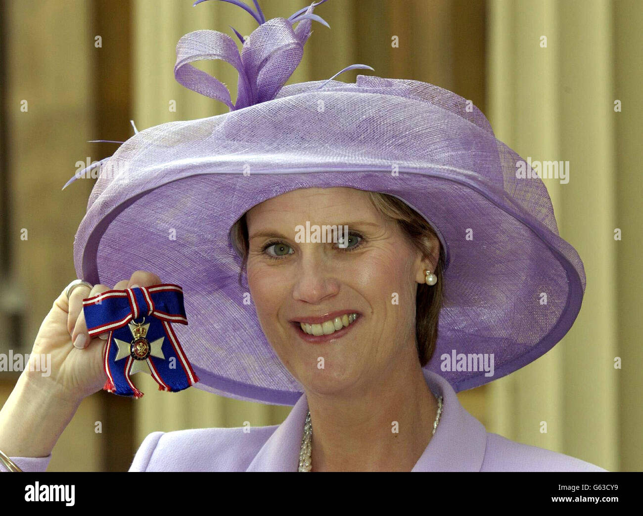 Member of the Saint James' Palace staff, Amanda Foster, receives her ...