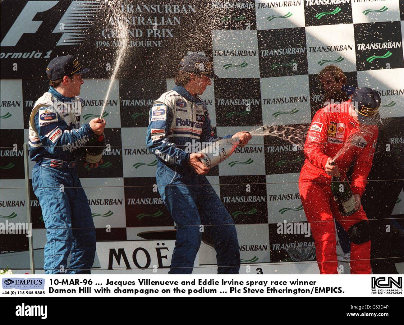 10-MAR-96. Jacques Villeneuve and Eddie Irvine spray race winner Damon ...