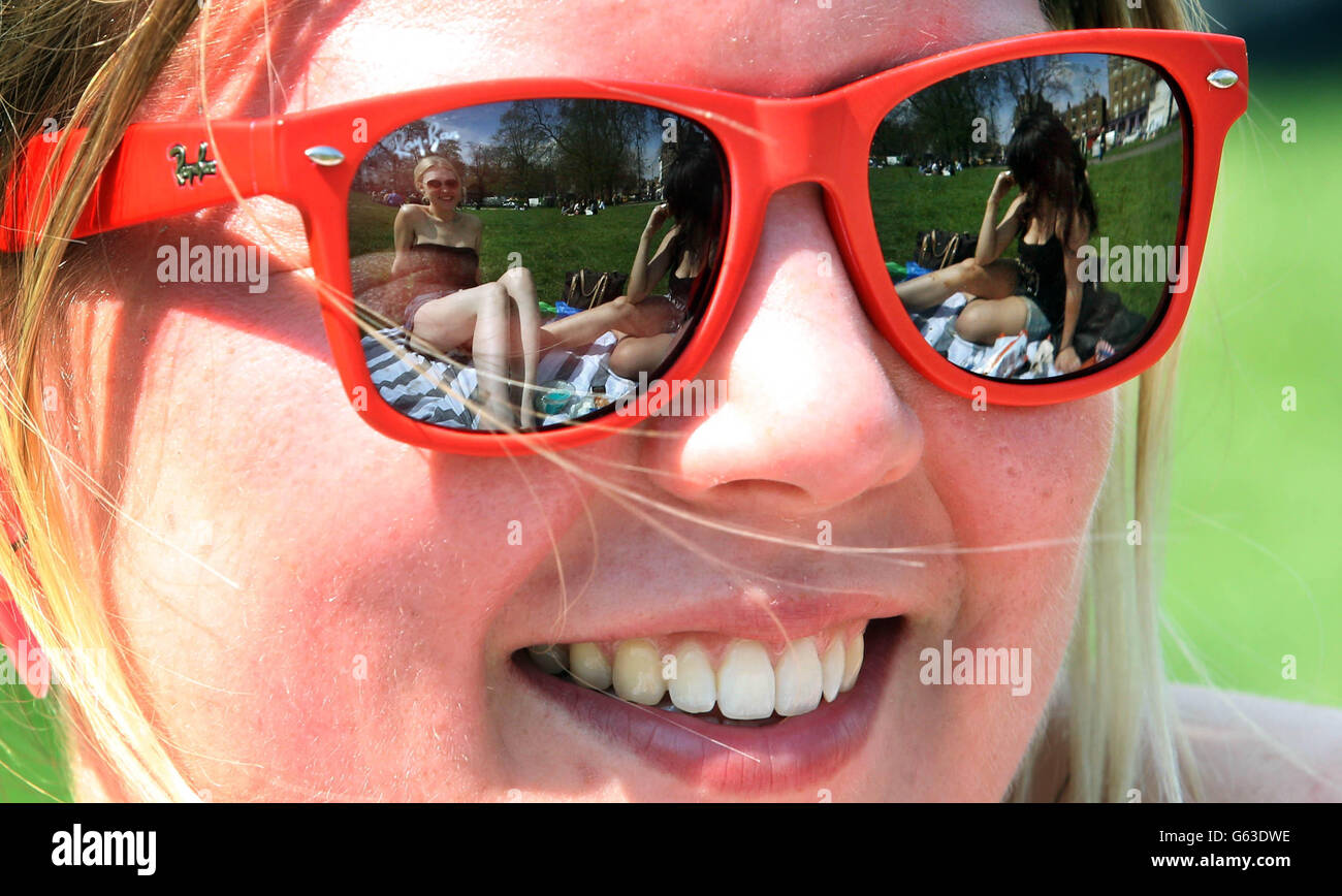 Melina Teske 21, enjoys the hot weather on Clapham Common in London ...