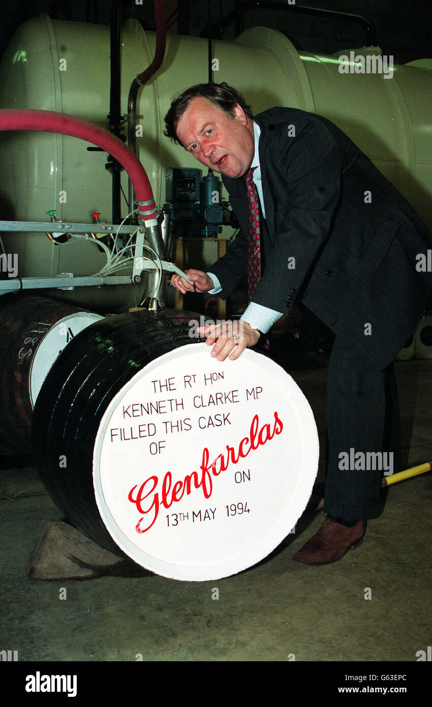 Kenneth Clarke fills whisky barrel Stock Photo - Alamy