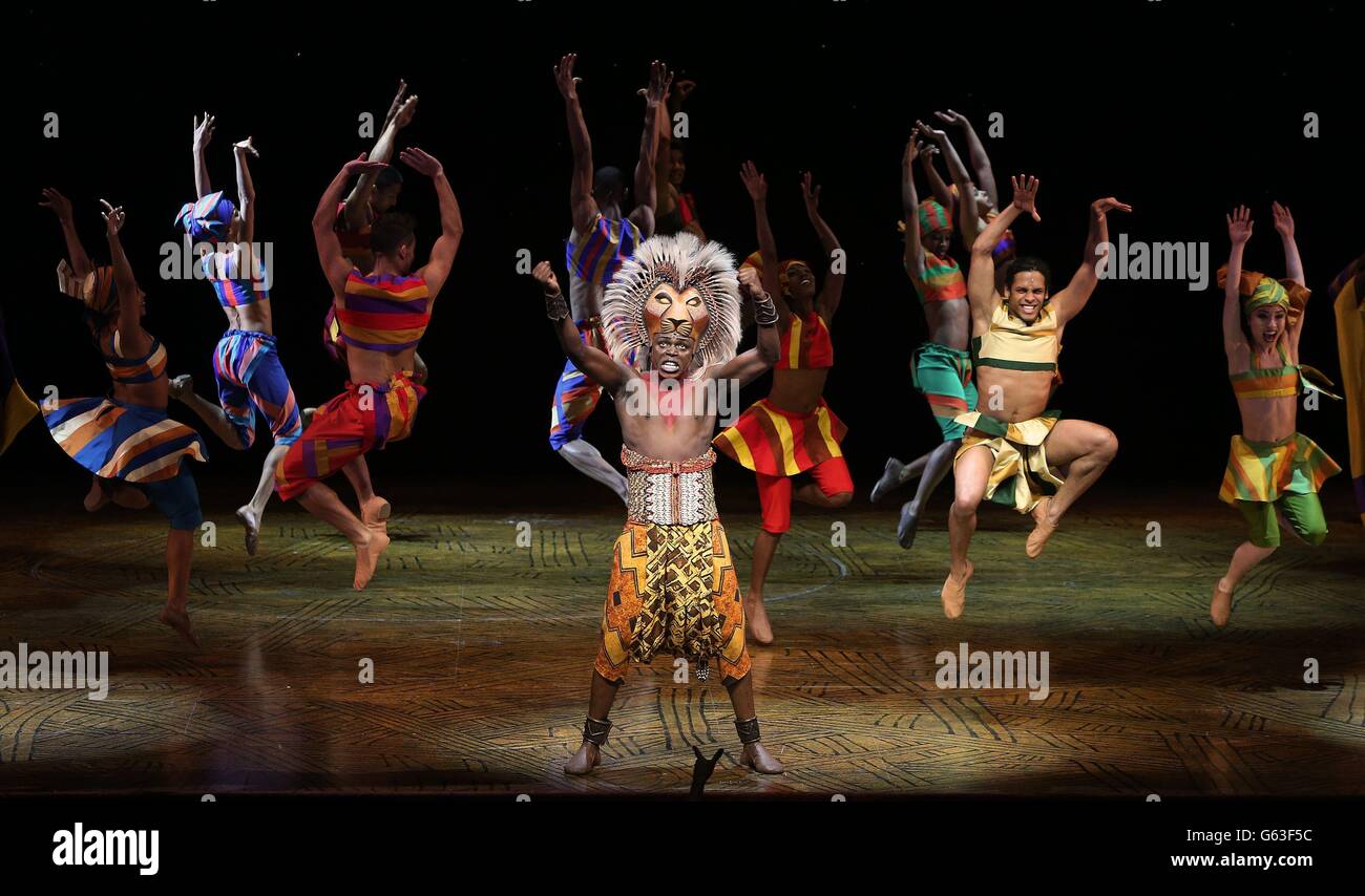 Nicholas Nkuna as Simba with the cast from Disney's The Lion King stage ...