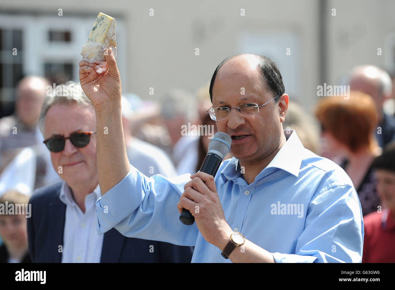 North West Cambridgeshire MP Shailesh Vara holds up a piece of Stilton ...