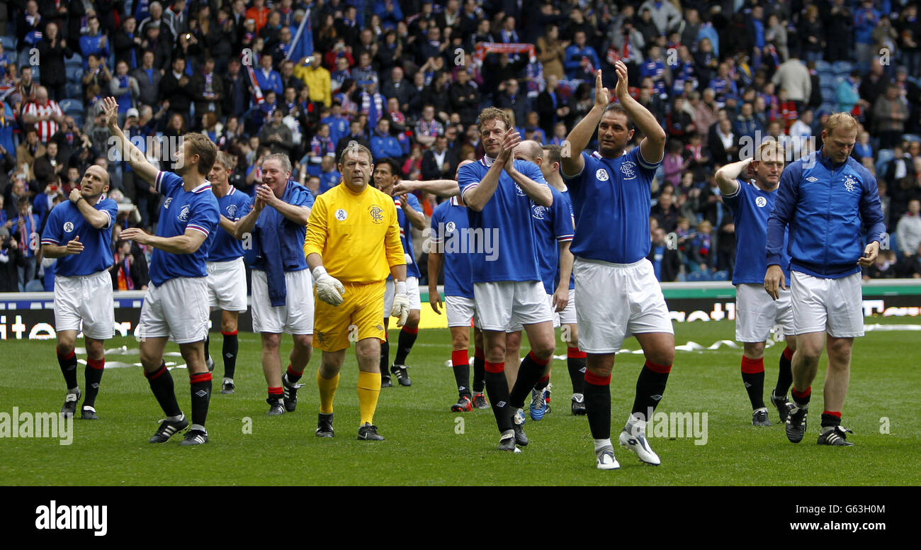 Rangers players celebrate following the legends match at ibrox stadium ...