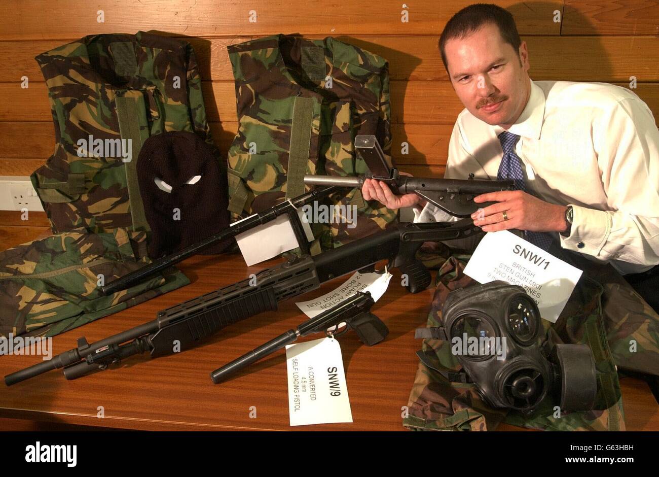 Detective sergeant phil murphy pictured with weapons including sten gun ...