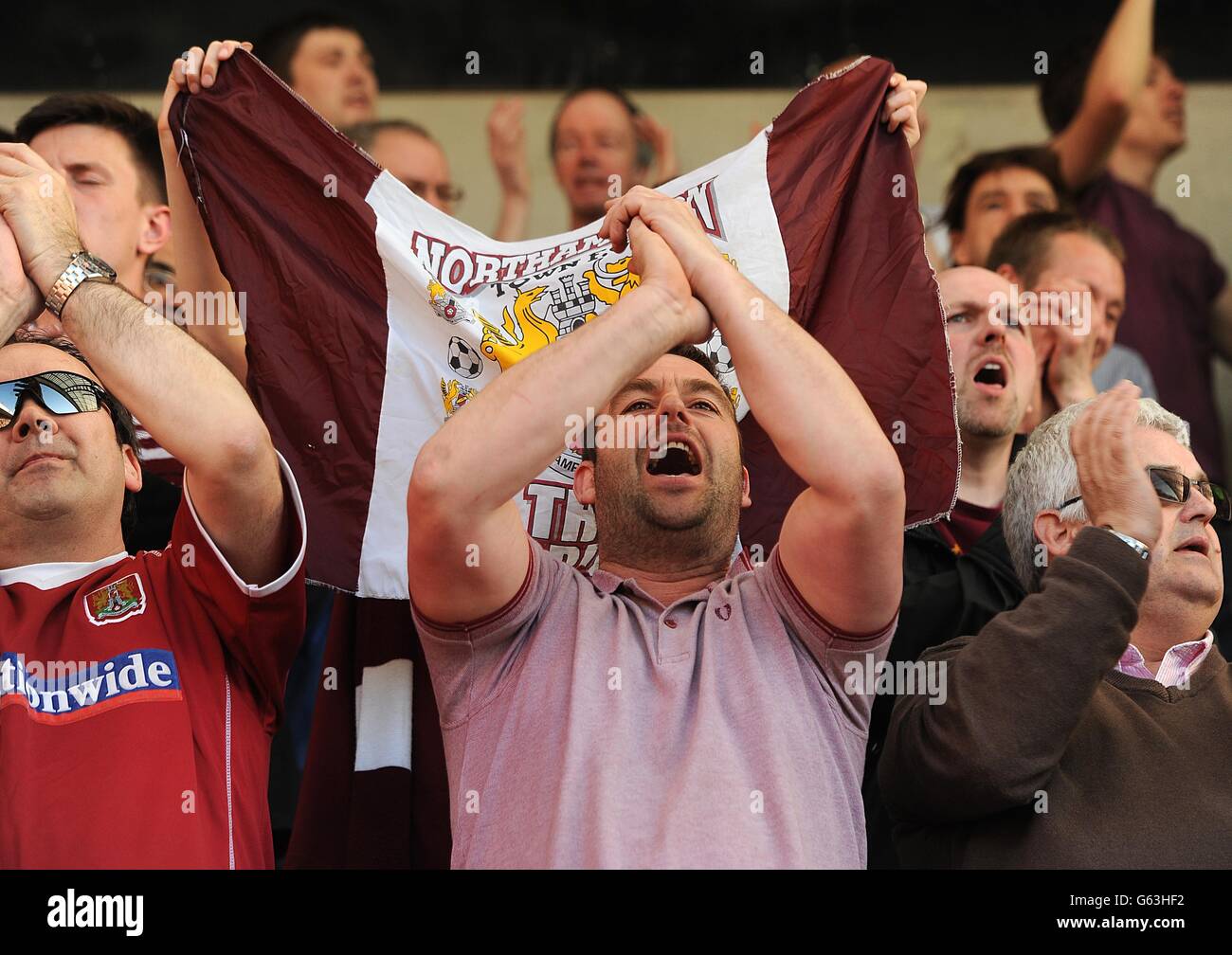 Northampton Town fans cheer on their side in the stands Stock Photo - Alamy