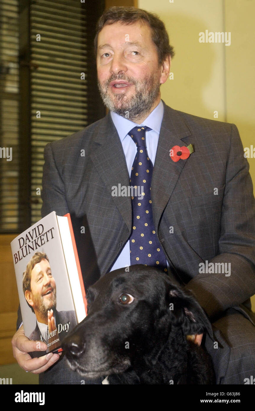 Home Secretary David Blunkett poses with his guide dog Lucy at the ...
