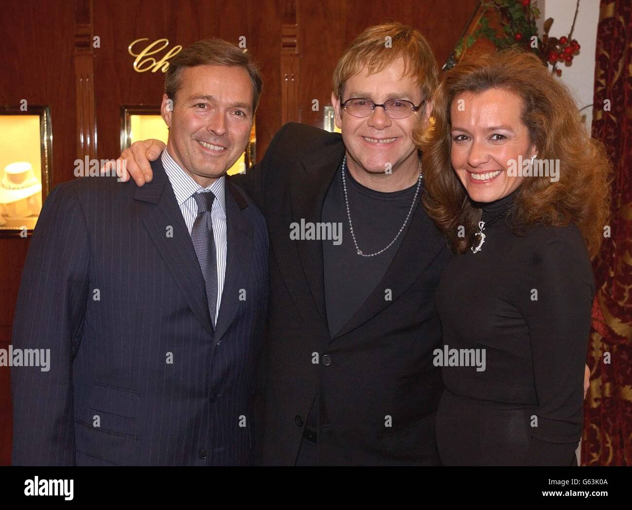 Sir Elton John (centre) vice presidents of Chopard, Caroline Gruosi ...