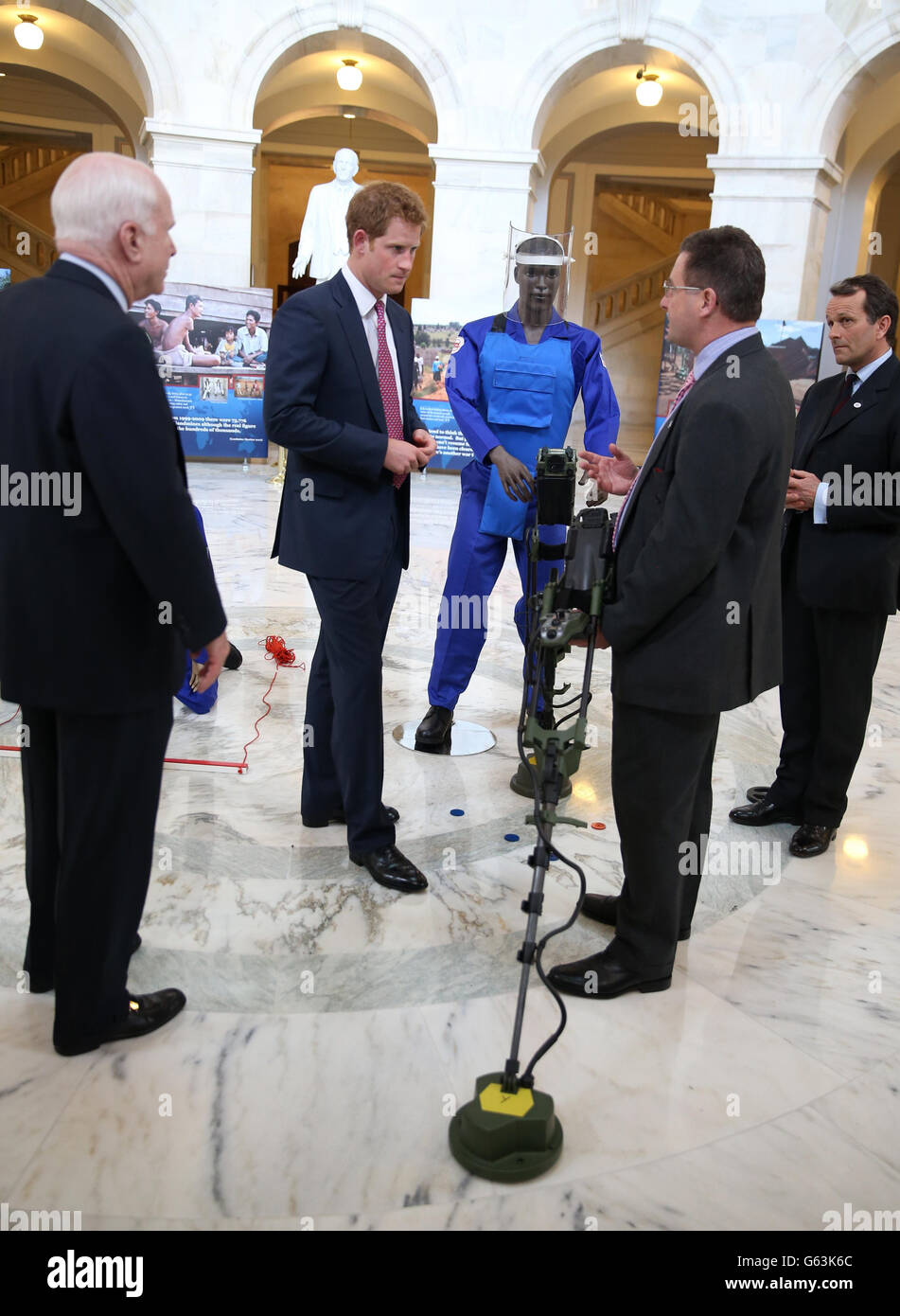 Senator John McCain and Prince Harry tour an anti-landmine photography ...