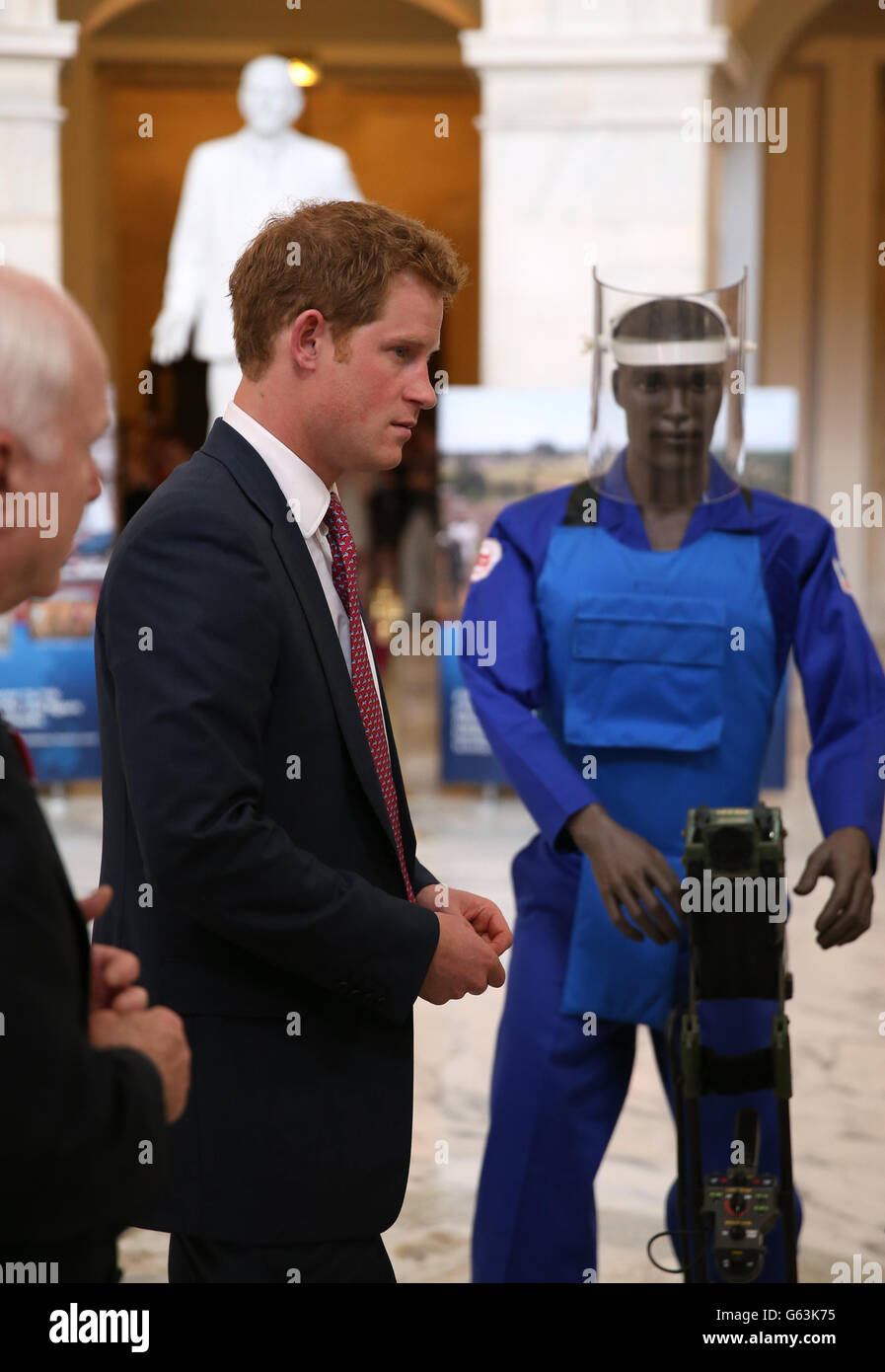 Senator John McCain and Prince Harry tour an anti-landmine photography ...