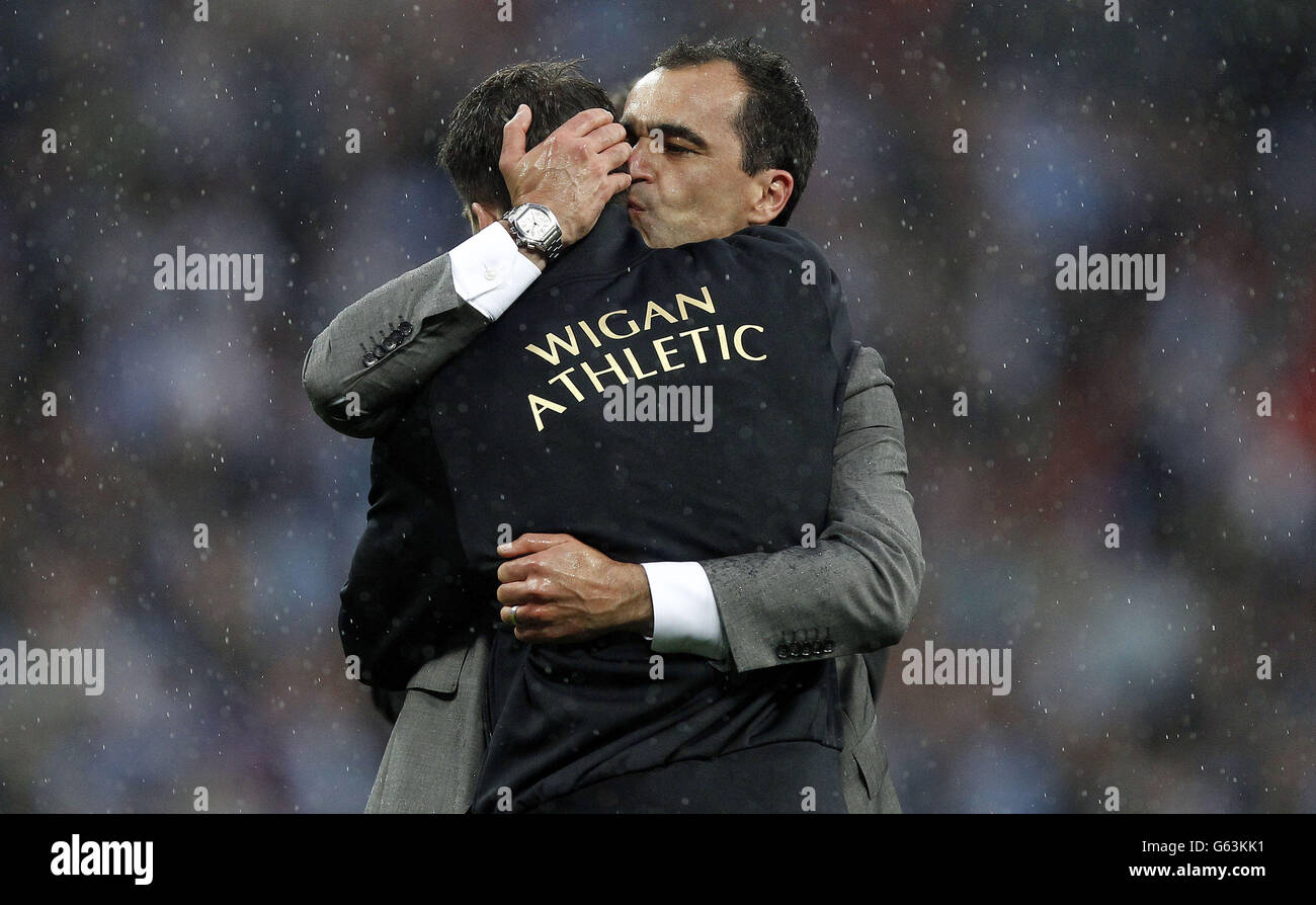 Wigan Athletic manager Roberto Martinez with a kiss for his player ...