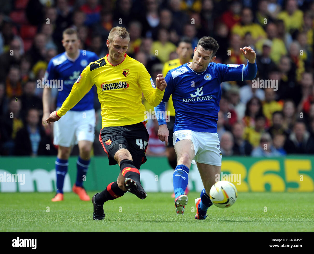 Watford's Joel Ekstrand (left) and Leicester City's David Nugent battle ...