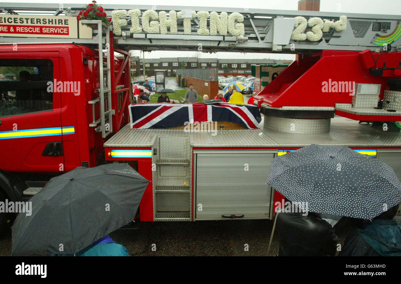 The coffin of Leicestershire fireman Robert Miller is carried on a ...