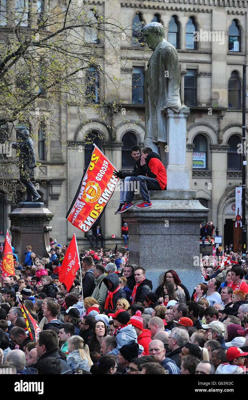 Fans sit on the statue of Oliver Heywood in Albert Square before the ...