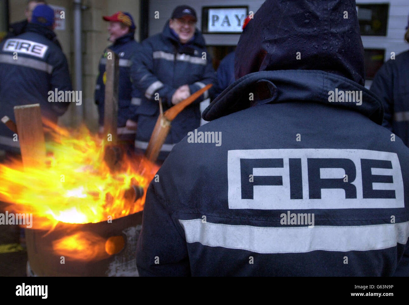 Firefighters stand outside the Tollcross fire station in Edinburgh ...