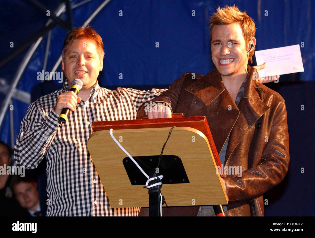 Pop singer Will Young, accompanied by DJ Mark Goodier, switching on the ...